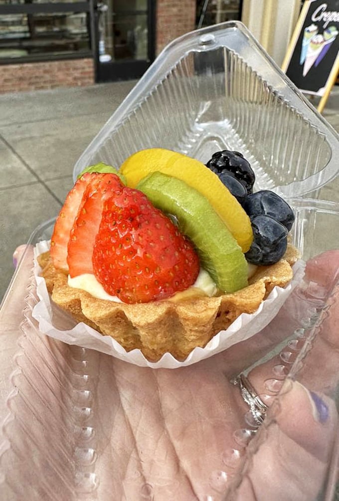 Behold the famous fruit tart in all its glory &ndash; a buttery shell cradling custard and fruit arranged with such precision it feels almost criminal to disturb it.