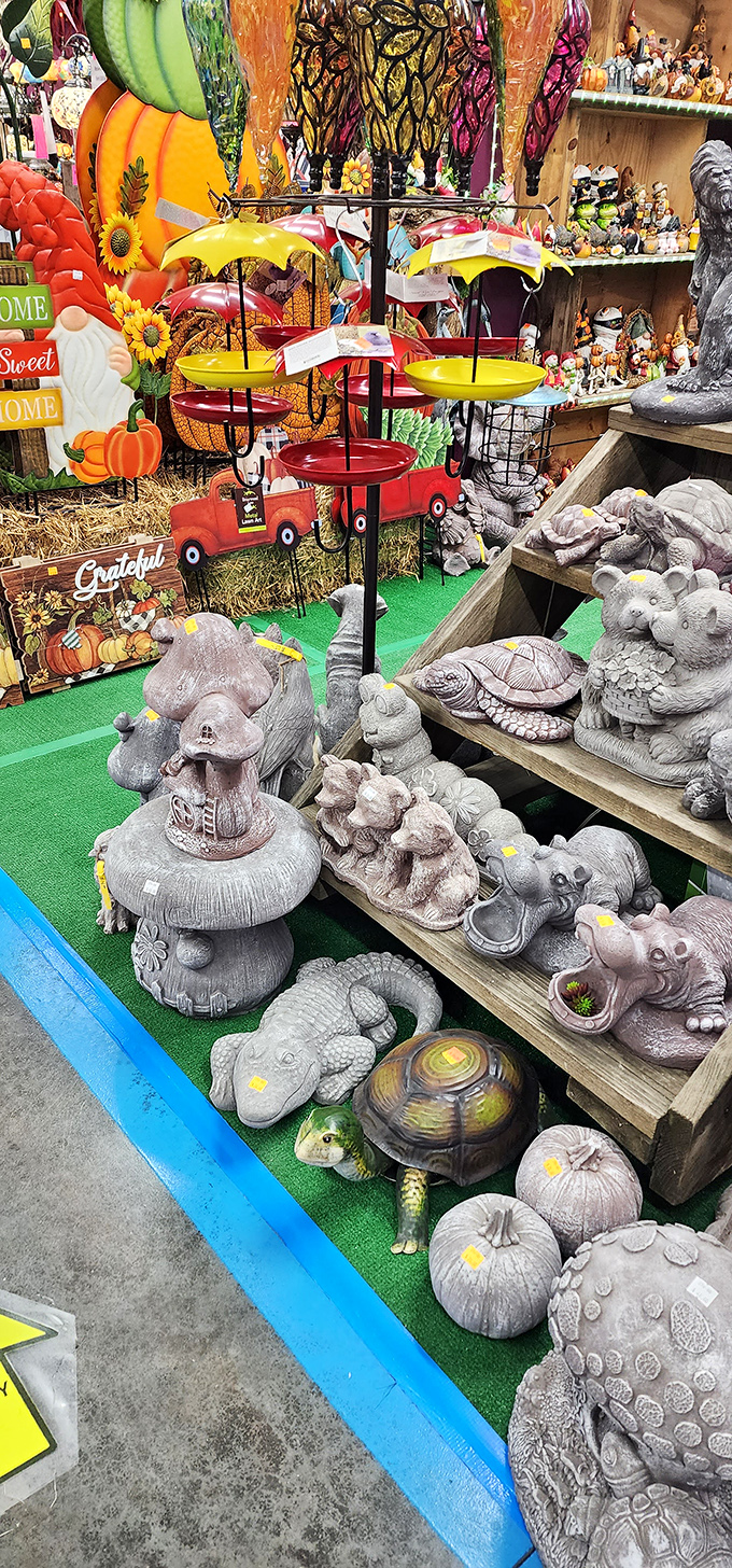 Garden ornament heaven! Where concrete turtles and mushroom houses coexist peacefully with red truck bird feeders in a whimsical outdoor decor ecosystem.