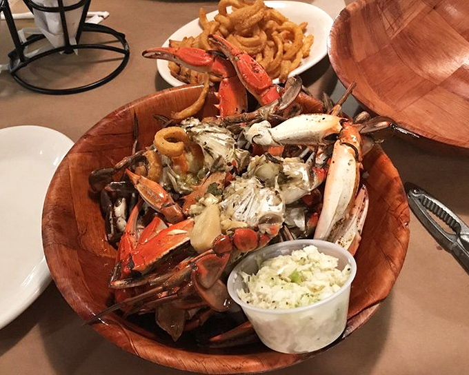 Behold the wooden bowl of glory&mdash;garlic crabs piled high like edible treasure from Neptune's personal stash.