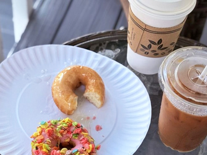 A simple glazed donut with a bite missing &ndash; the universal symbol for "I couldn't wait to take a picture before tasting this masterpiece."