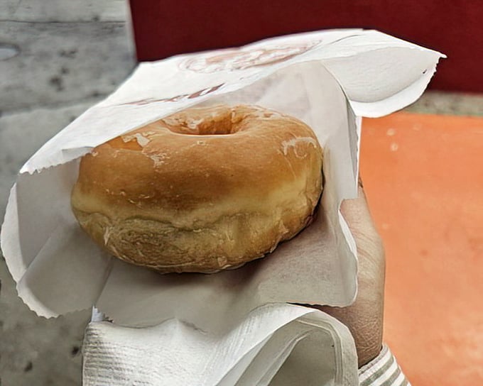 This glazed donut isn't trying to reinvent the wheel&mdash;it's just perfecting it. The glassy sheen promises that perfect first bite.