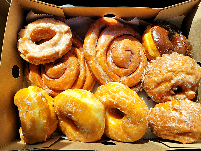 Donut nirvana in cardboard form. That golden-brown perfection isn't just breakfast&mdash;it's an edible hug for your taste buds.