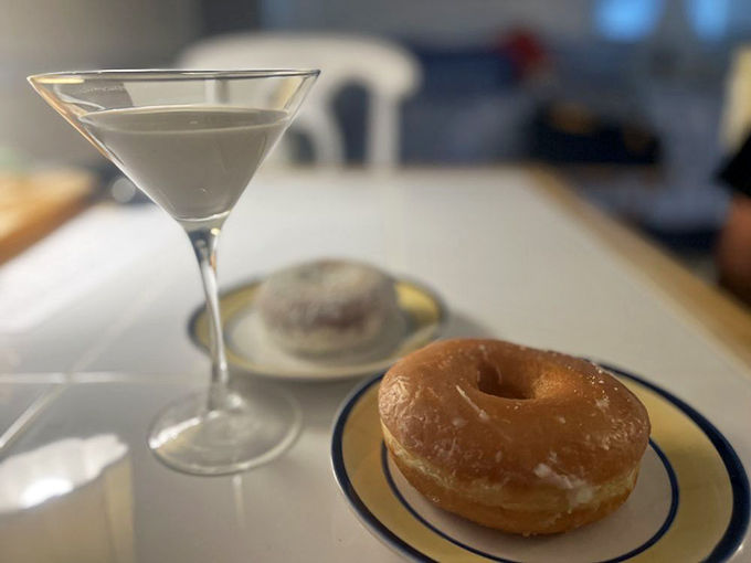 The glazed donut in its natural habitat, glistening like morning dew. Paired with a martini because... Florida.
