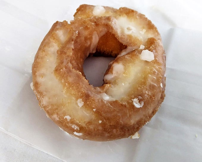 Behold the golden standard: a glazed donut so perfectly imperfect it makes mass-produced circles of sadness weep with envy.