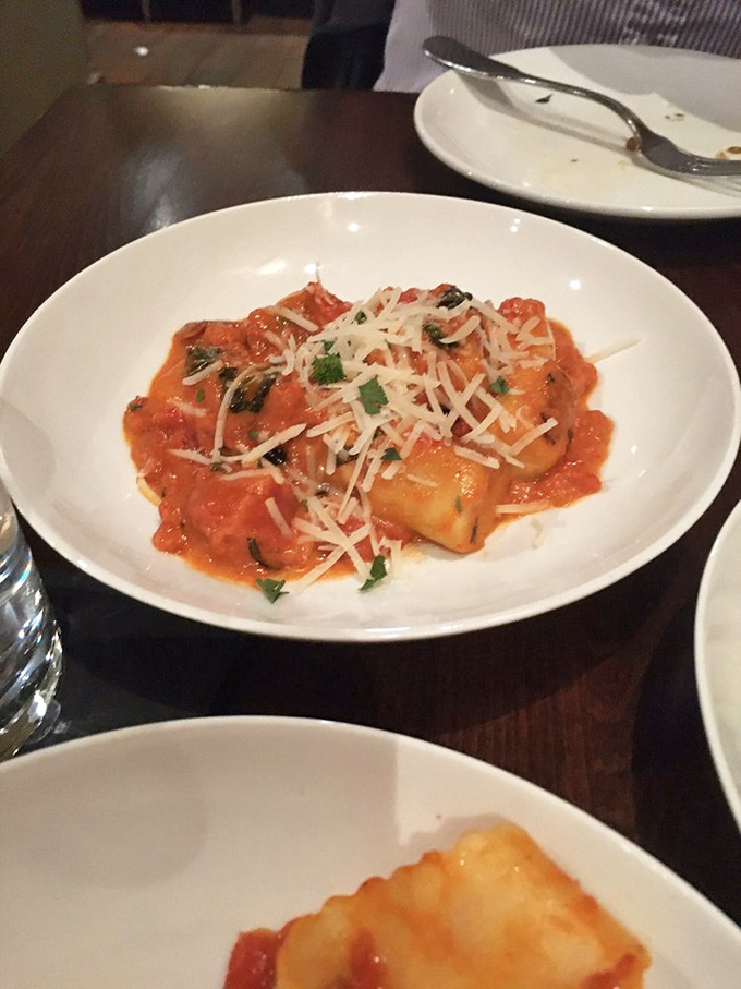 These gnocchi aren't just pasta; they're pillowy clouds of potato perfection swimming in a tomato sauce that deserves its own fan club.