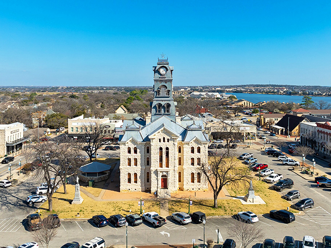 The Hood County Courthouse stands proud as Granbury's crown jewel, its clock tower keeping watch over the town like a limestone guardian angel.