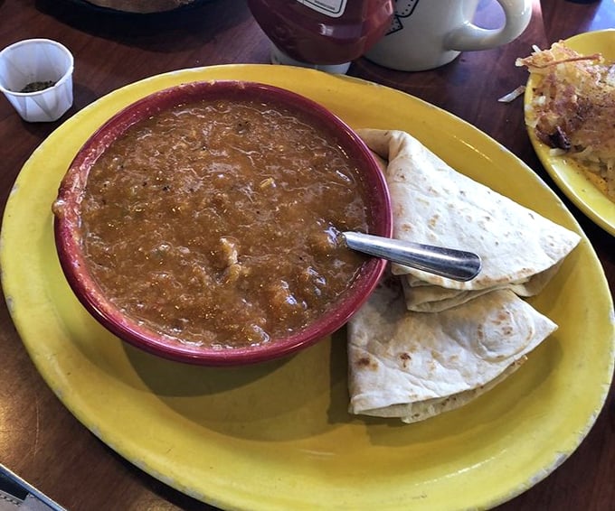 This isn't just green chili&mdash;it's liquid Colorado sunshine in a bowl. The perfect marriage of heat and flavor that makes tortillas weep with joy.