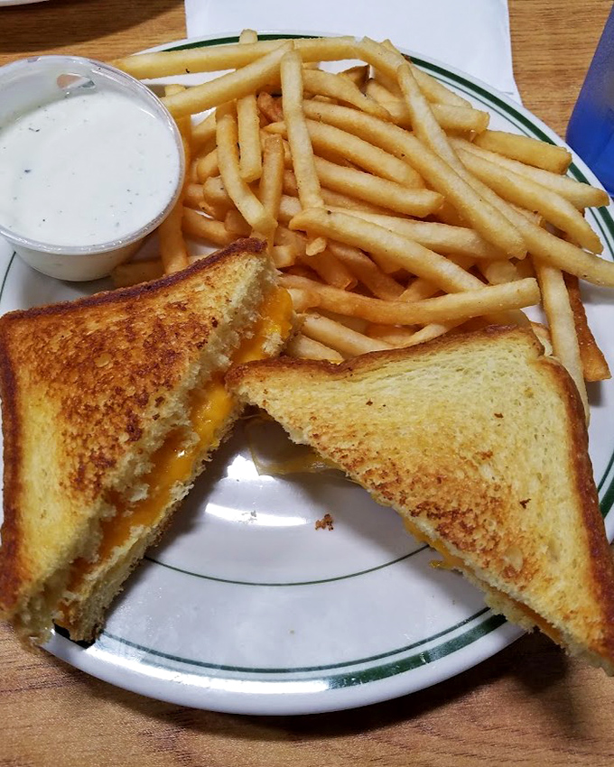 Behold the star of our show: a grilled cheese sandwich so perfectly golden and gooey, it makes all other sandwiches seem like mere practice runs.
