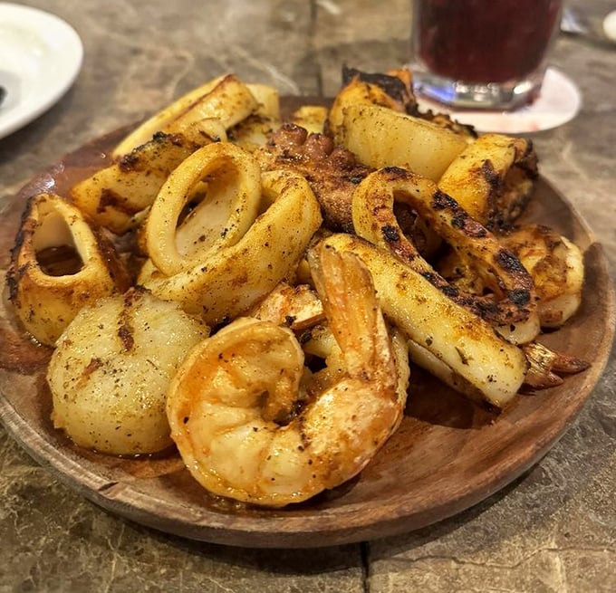 Grilled calamari and shrimp that look like they jumped from ocean to plate, with char marks that should be framed in a culinary museum.