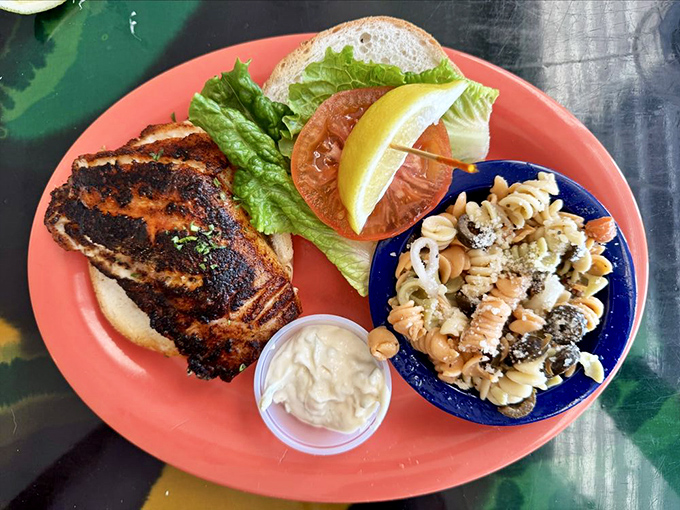 Behold the legendary grouper sandwich &ndash; blackened to perfection with pasta salad that deserves its own fan club.