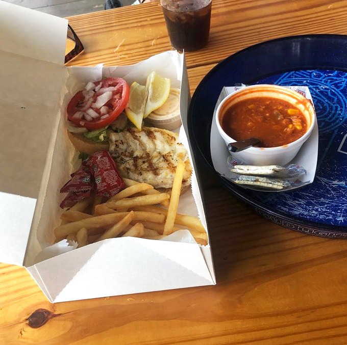 The holy grail of Florida dining: a perfectly grilled grouper sandwich. Paired with a cup of hearty fish chowder, it's the coastal equivalent of comfort food.