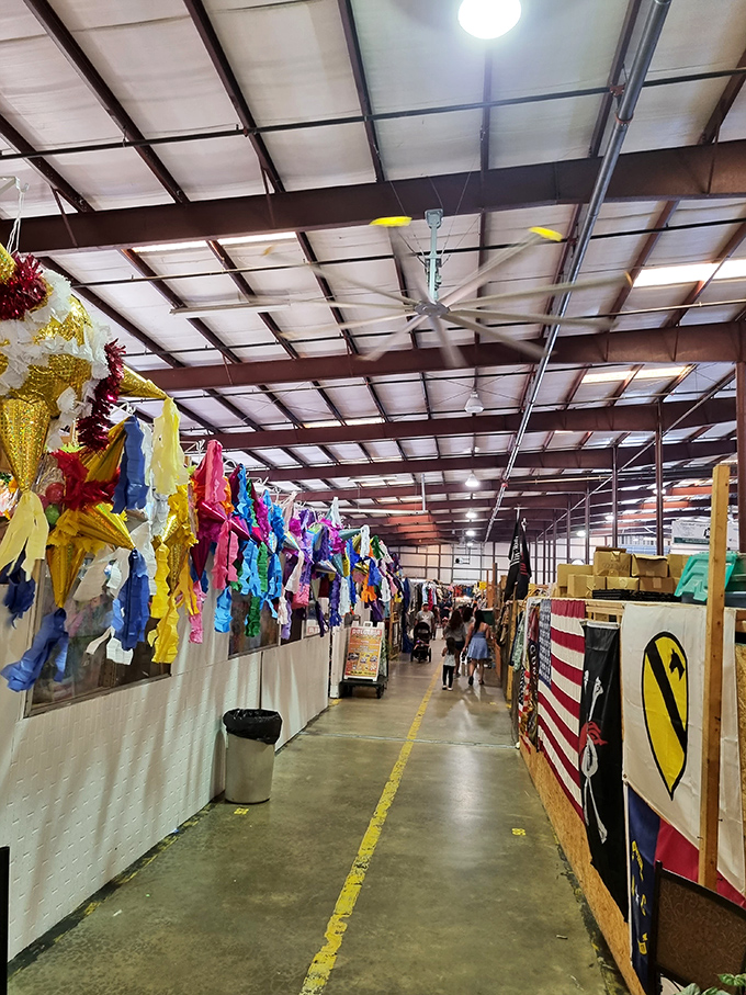 Down the yellow-lined path we go! Overhead fans keep the air moving while vibrant merchandise creates a kaleidoscope of retail therapy opportunities.