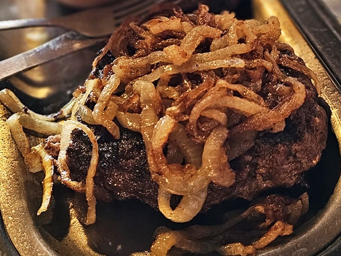 This isn't just any hamburger steak&mdash;it's a masterpiece of Midwestern comfort, crowned with crispy onions that add the perfect textural counterpoint.