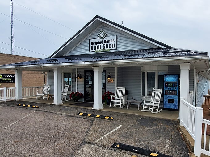 Rocking chairs on the porch of Helping Hands Quilt Shop invite you to sit a spell, as generations of crafters have done before deciding on just the right fabric.