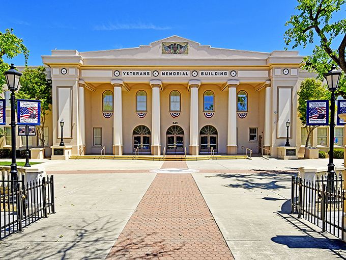 The Veterans Memorial Building stands as a dignified sentinel of local history, its stately columns and patriotic bunting honoring those who served.