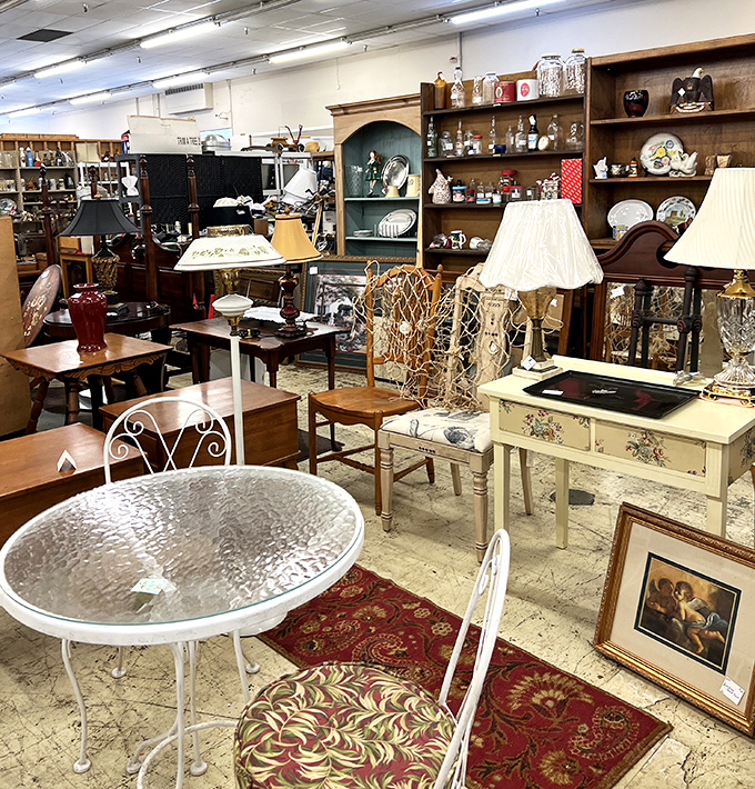 White wrought iron furniture mingles with wooden treasures in this perfectly organized maze of memories.