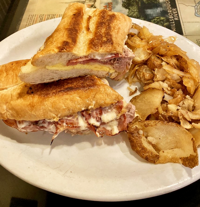 This Cuban sandwich isn't just pressed – it's been given a bear hug by the grill, resulting in that perfect golden crunch that makes resistance futile.