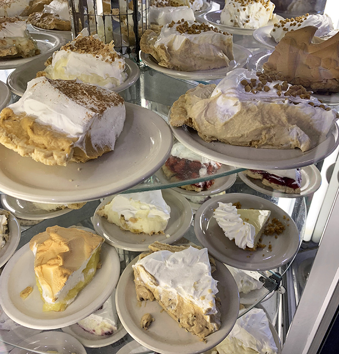 The pie case at Yoder's is what I imagine heaven's reception area looks like—a glorious display of cream-topped perfection that makes choosing just one a divine challenge.