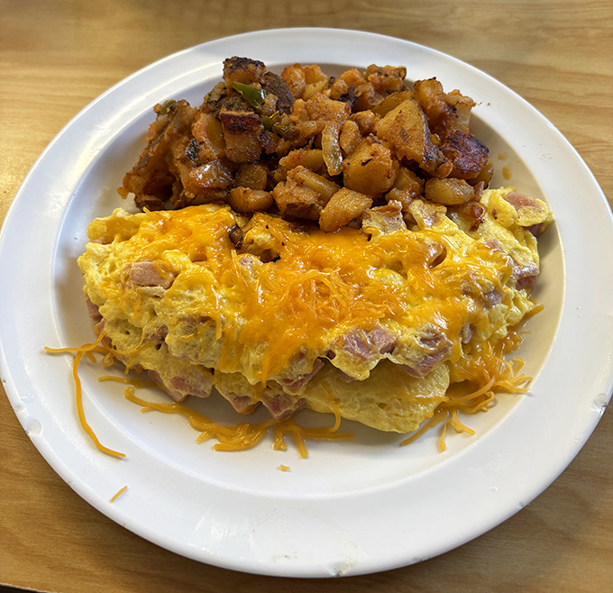 Behold: the ham and cheese omelet that launched a thousand food dreams. Those potatoes aren't side characters&mdash;they're co-stars in this breakfast blockbuster.