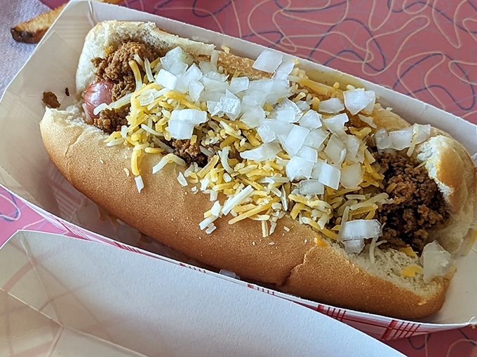 This isn't just a chili dog&mdash;it's an edible history lesson. Topped with enough cheese and onions to make your cardiologist wince but your taste buds applaud.