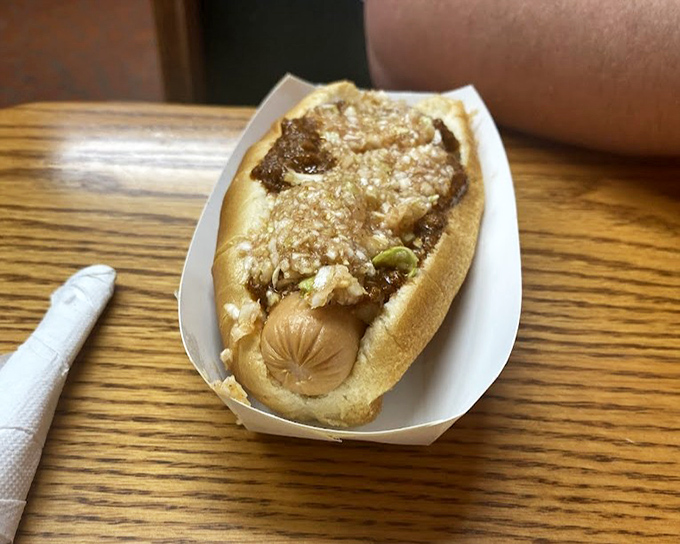 Meet the hot dog that's stealing the spotlight from its more famous barbecue siblings. That chili topping deserves its own fan club.