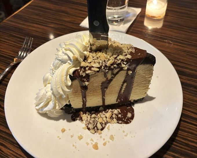 The legendary ice cream cake that launched a thousand road trips. Layers of creamy perfection crowned with chocolate and nuts that would make your childhood self high-five your adult self.