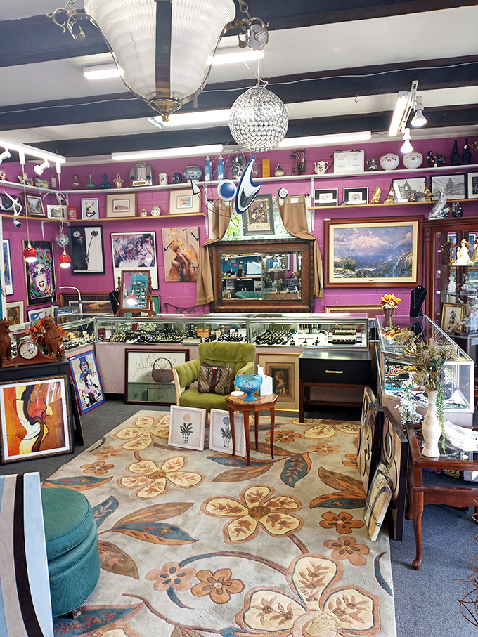 A floral area rug anchors this eclectic space where vintage meets modern, creating a collector's dream landscape.