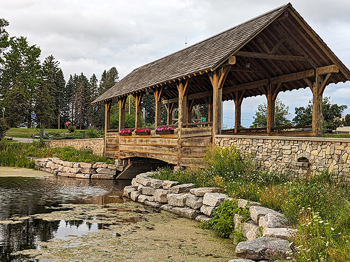 This rustic covered bridge at Island Park looks like it belongs on a calendar, connecting visitors to nature trails and peaceful picnic spots away from life's digital noise.