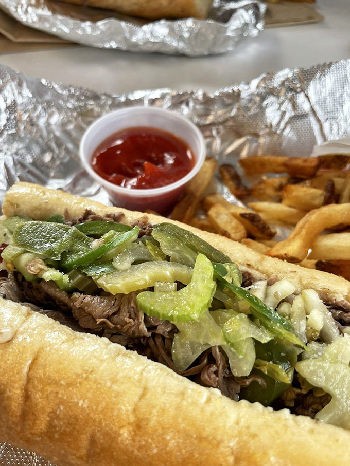 Behold the star of the show: thinly sliced beef piled high, giardiniera adding that perfect kick, all nestled in bread that somehow defies the laws of structural engineering.