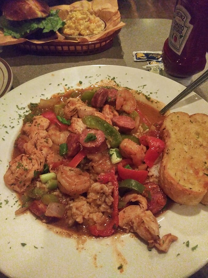 This isn't just jambalaya; it's a colorful celebration in a bowl where shrimp, sausage, and chicken throw the party of the year.