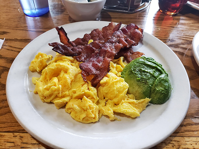 Breakfast simplicity perfected: fluffy scrambled eggs, crispy bacon, and fresh avocado. Keto-friendly fuel that would make even carb-lovers jealous. 