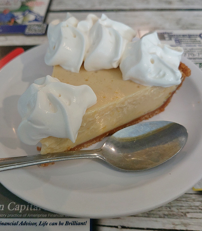 This key lime pie achieves dessert nirvana &ndash; tart, sweet, and crowned with clouds of whipped cream perfection.