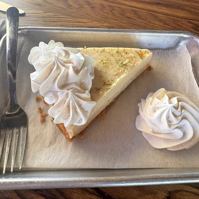 The star of the show: A slice of key lime pie that strikes the perfect balance between tart and sweet, topped with pillowy whipped cream rosettes.