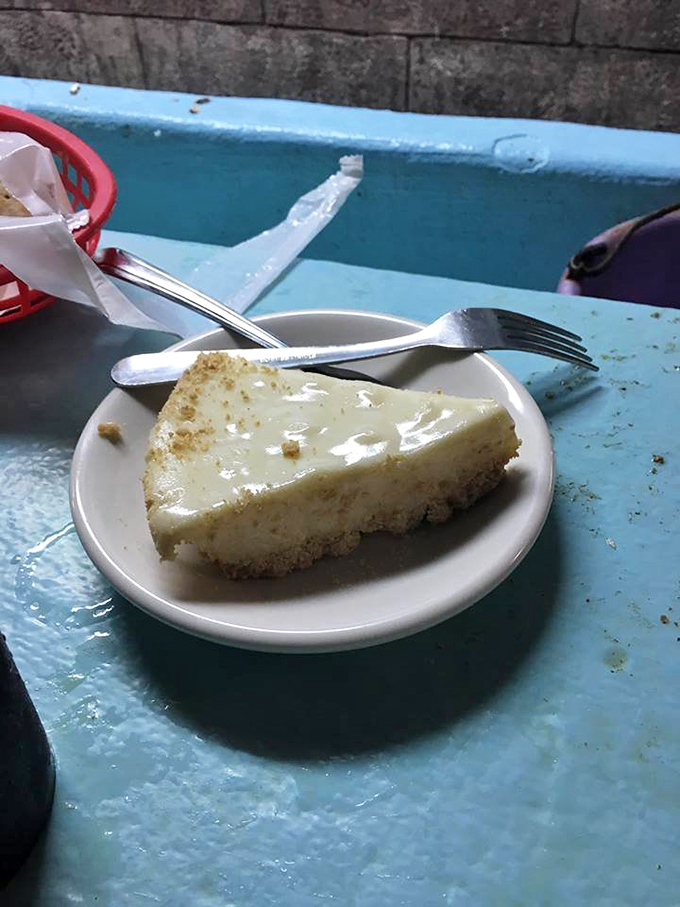 Key lime pie that makes time stand still. That pale yellow hue signals authenticity&mdash;no food coloring here, just pure, tangy-sweet Florida sunshine transformed into creamy perfection.