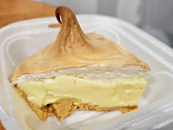 This slice of key lime pie isn't just dessert; it's Florida's soul on a plate&mdash;tart, sweet, and topped with a meringue peak that demands a moment of silent appreciation.