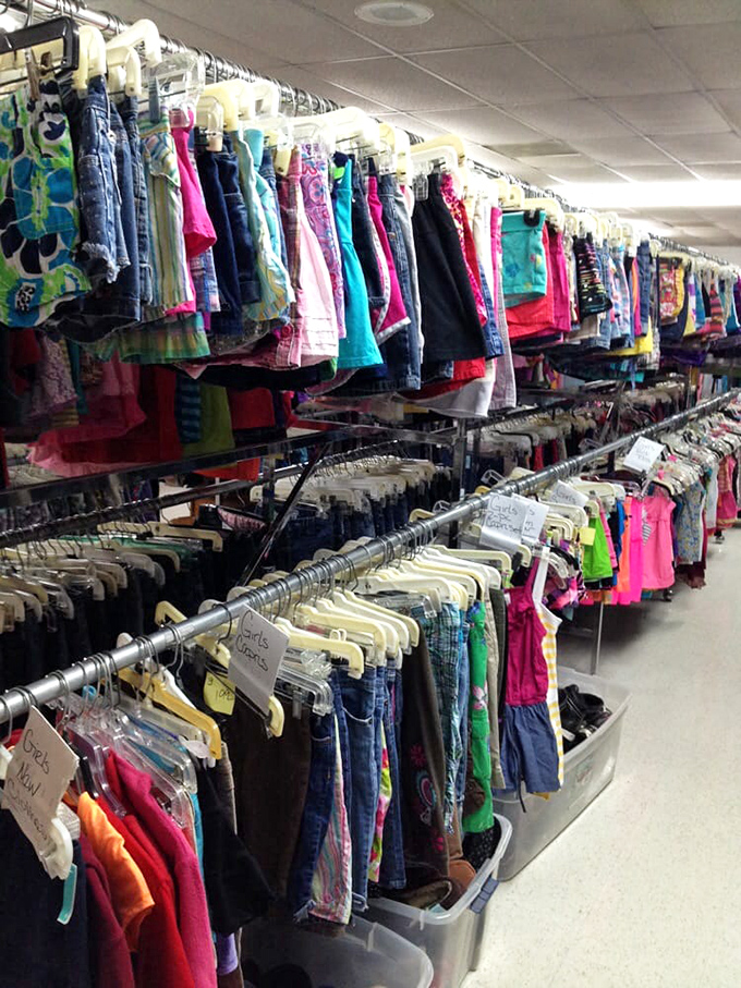 A rainbow of children's clothing hangs expectantly, each tiny garment with stories to tell and plenty of Florida sunshine left to absorb.