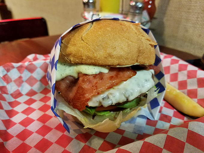 Blue cheese and bacon create a symphony of savory indulgence. This isn't just a burger; it's a masterclass in proper ingredient architecture.