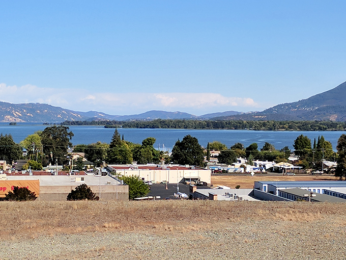 Clear Lake stretches toward the horizon, cradled by mountains that seem to whisper ancient geological secrets. Nature's masterpiece on full display.