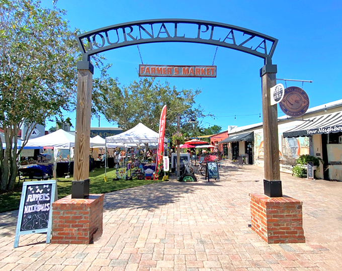 Journal Plaza's farmer's market entrance stands as a gateway to affordable produce and neighborly gossip &ndash; both equally fresh.