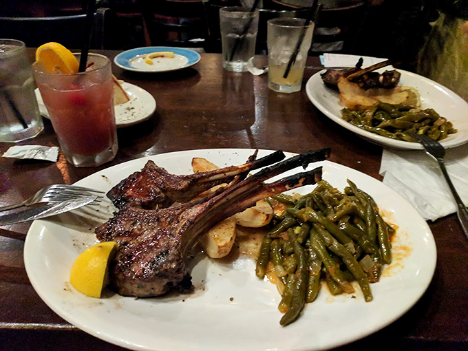These aren't just lamb chops; they're the reason Floridians set their GPS for Orlando, perfectly charred outside, pink within, and flanked by green beans that actually taste like vegetables should.