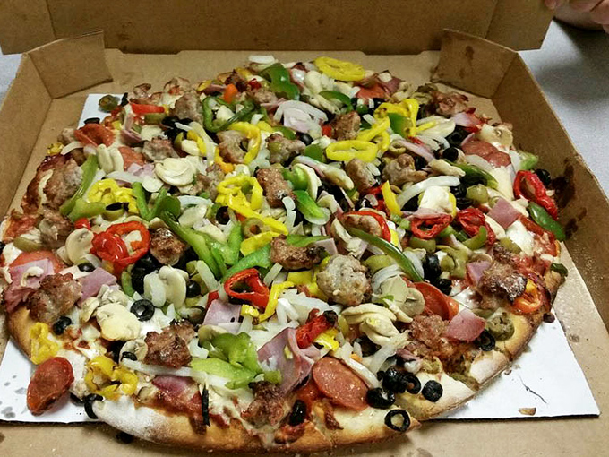 Pizza perfection doesn't need filters. This colorful masterpiece of toppings proves that sometimes the best food styling is simply generous portions. 