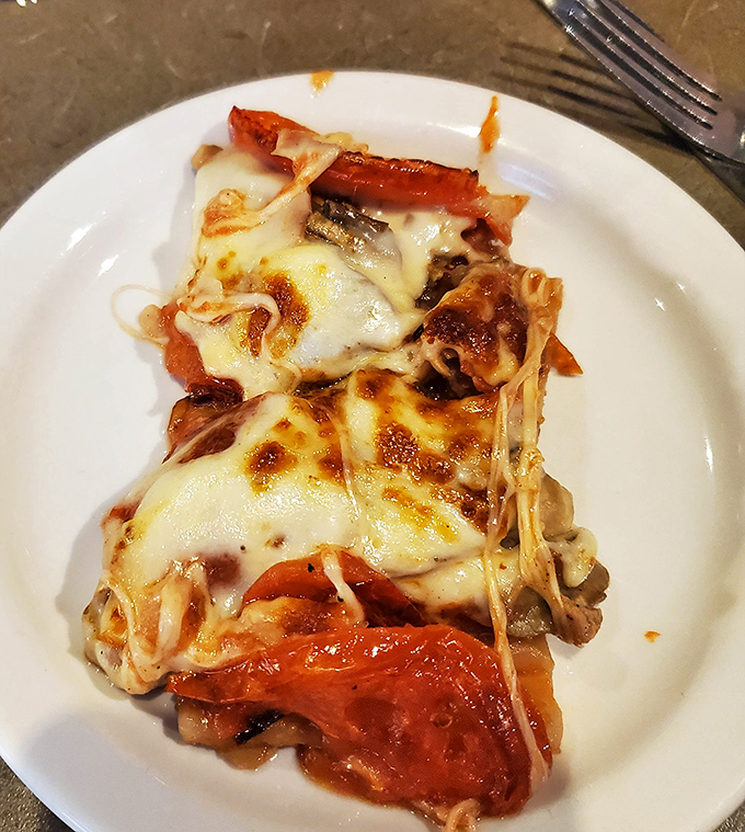 This isn't just lasagna – it's a geological marvel of pasta, cheese, and sauce that would make any Italian grandmother nod in approval.