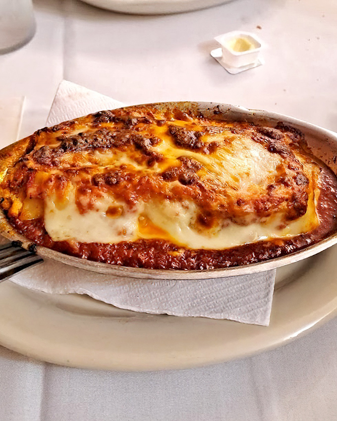 Lasagna that makes time stand still&mdash;layers of pasta, cheese, and that legendary sauce creating a bubbling masterpiece worth driving across state lines for.
