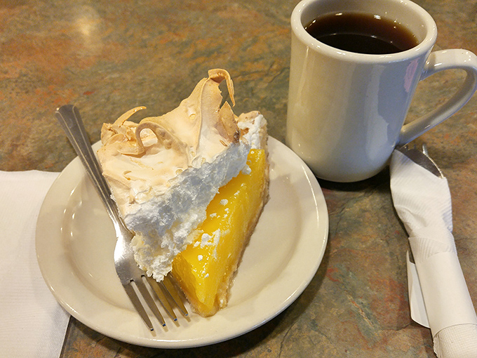 This isn't just lemon meringue pie; it's a towering achievement of sweet-tart perfection that demands a moment of reverential silence.