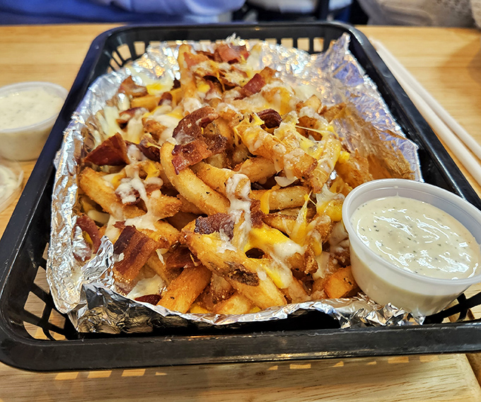 Behold the star of our show! These loaded fries aren't just a side dish&mdash;they're a religious experience of cheese, bacon, and ranch that demands your full attention.