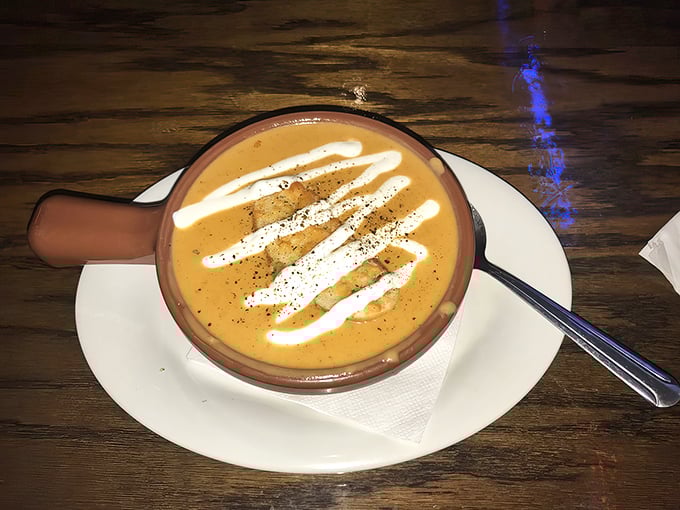 Behold the legendary lobster bisque in all its glory! Those artful cream swirls aren't just decoration&mdash;they're the culinary equivalent of a standing ovation.