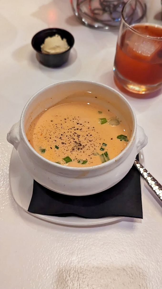 This bisque arrives looking innocent, but one spoonful reveals its deliciously criminal intentions &ndash; smooth as Sinatra, rich as Rockefeller.