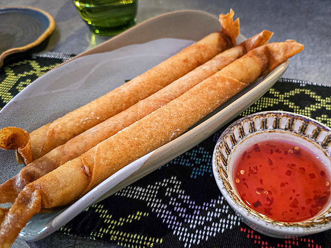 "Behold the famous Lumpiang Shanghai – crispy, golden cylinders of joy that make you wonder why you ever wasted time on ordinary spring rolls."