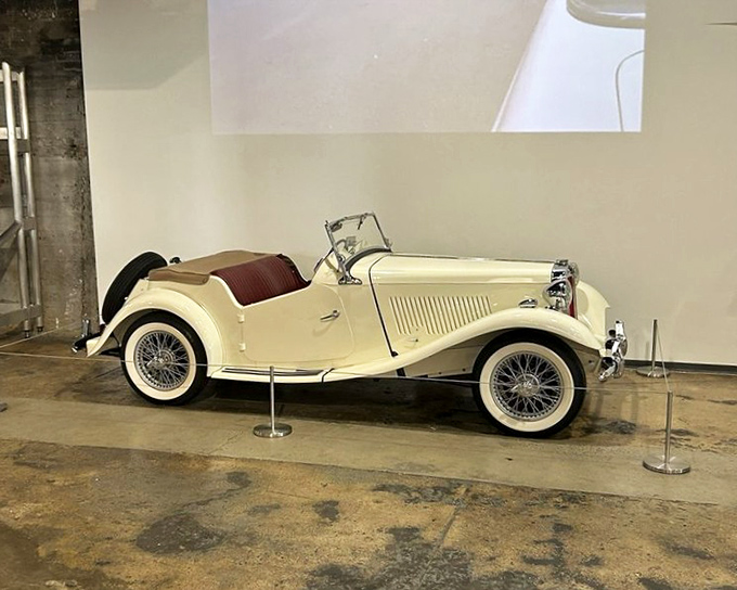 This cream-colored MG Midget T-Type whispers tales of winding European roads and Sunday drives, a mechanical time capsule from when sports cars were simple pleasures.
