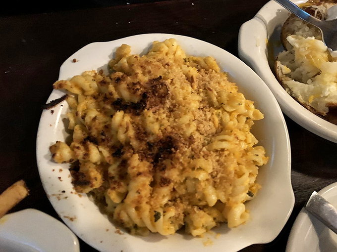 Mac and cheese so golden and inviting, it makes you wonder if this is what they meant by "the streets of heaven are paved with gold."